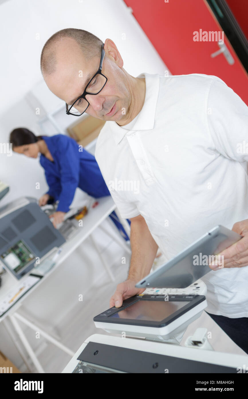 skillful male engineer using printing Stock Photo - Alamy