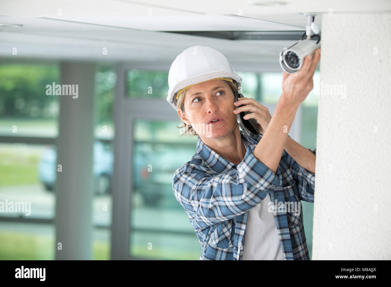 female professional cctv technician working Stock Photo - Alamy