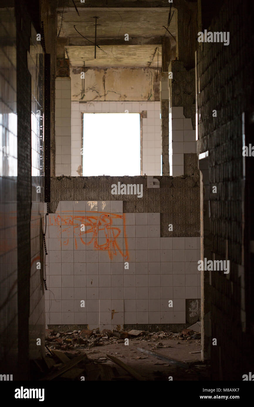 an abandoned, derelict hotel. Original building material was concrete ...