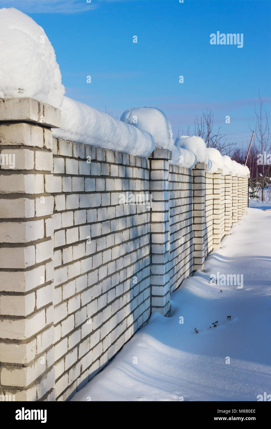 Brick wall, covered with snow in January in rural areas Stock Photo - Alamy