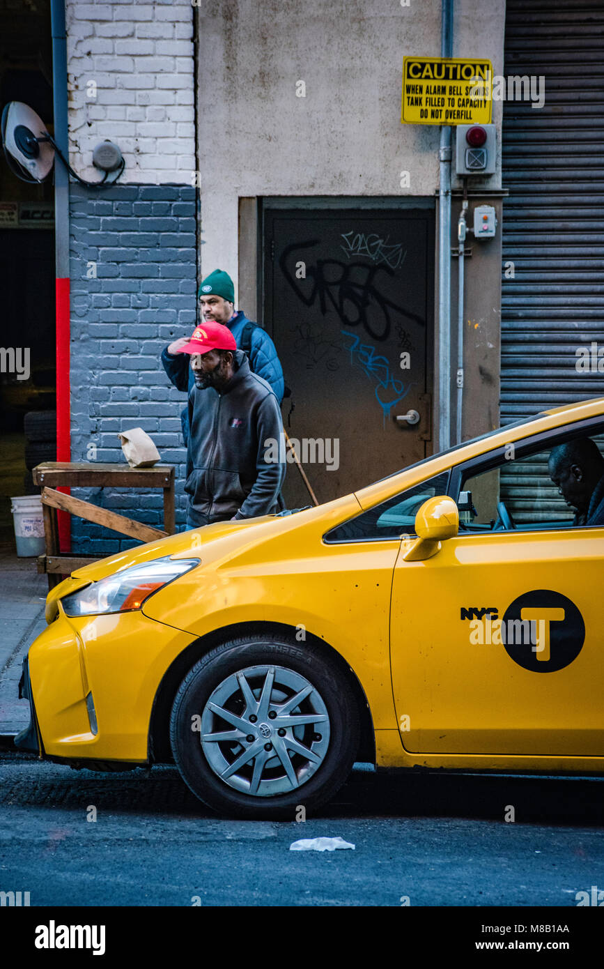 NYC, Manhattan street scenes. Tourists,Yellow taxi, cabs garage Stock ...