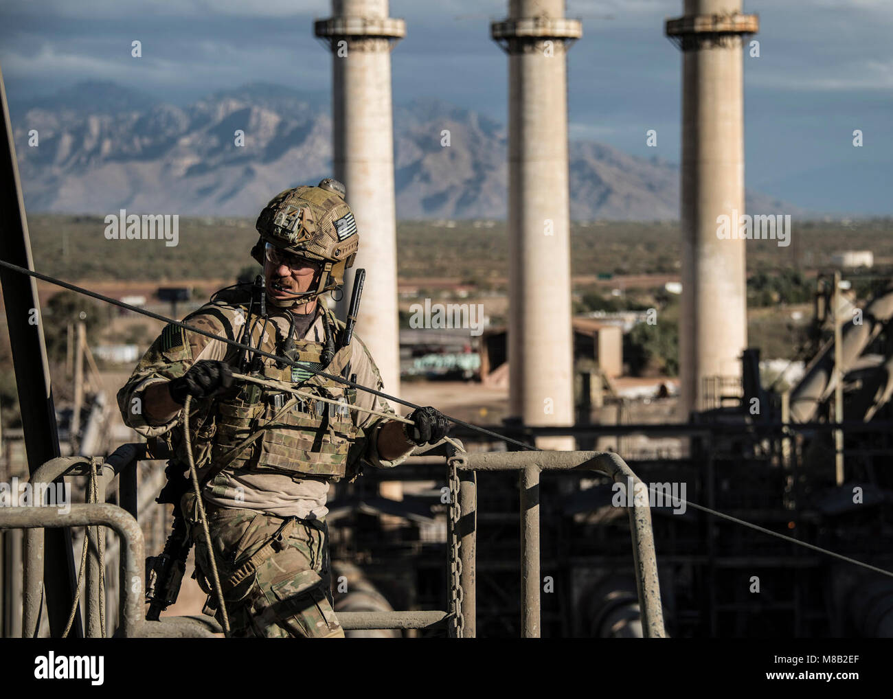 A U.S. Air Force pararescueman from the 48th Rescue Squadron retrieves ...