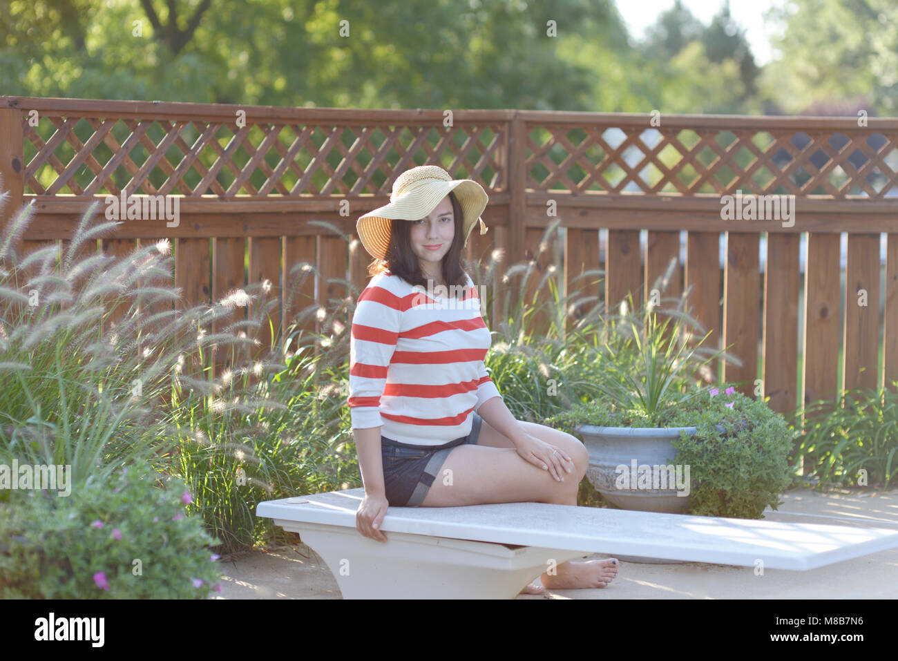 Woman in a straw hat outdoors in summer Stock Photo - Alamy