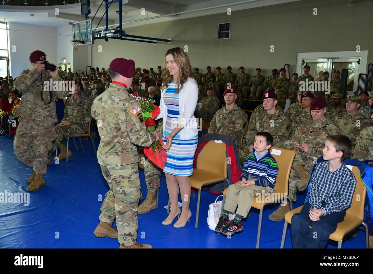 Mrs. Sarah, wife of incoming Command Sgt. Maj Erick E. Ochs, receives a ...