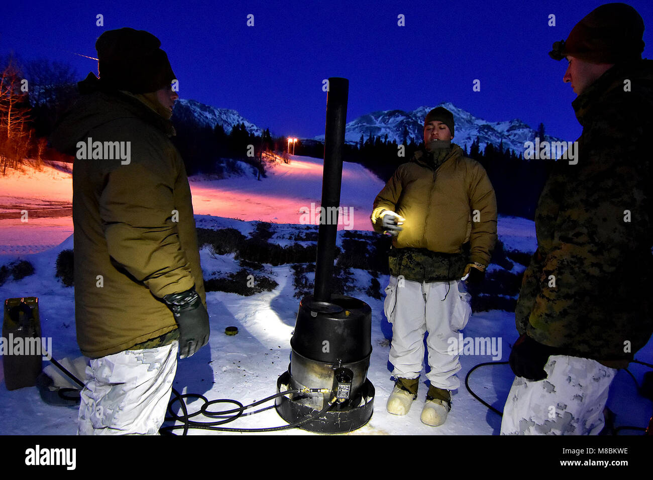 Marines prepare to light an H45 Space Heater Feb. 20, 2018, at the ...