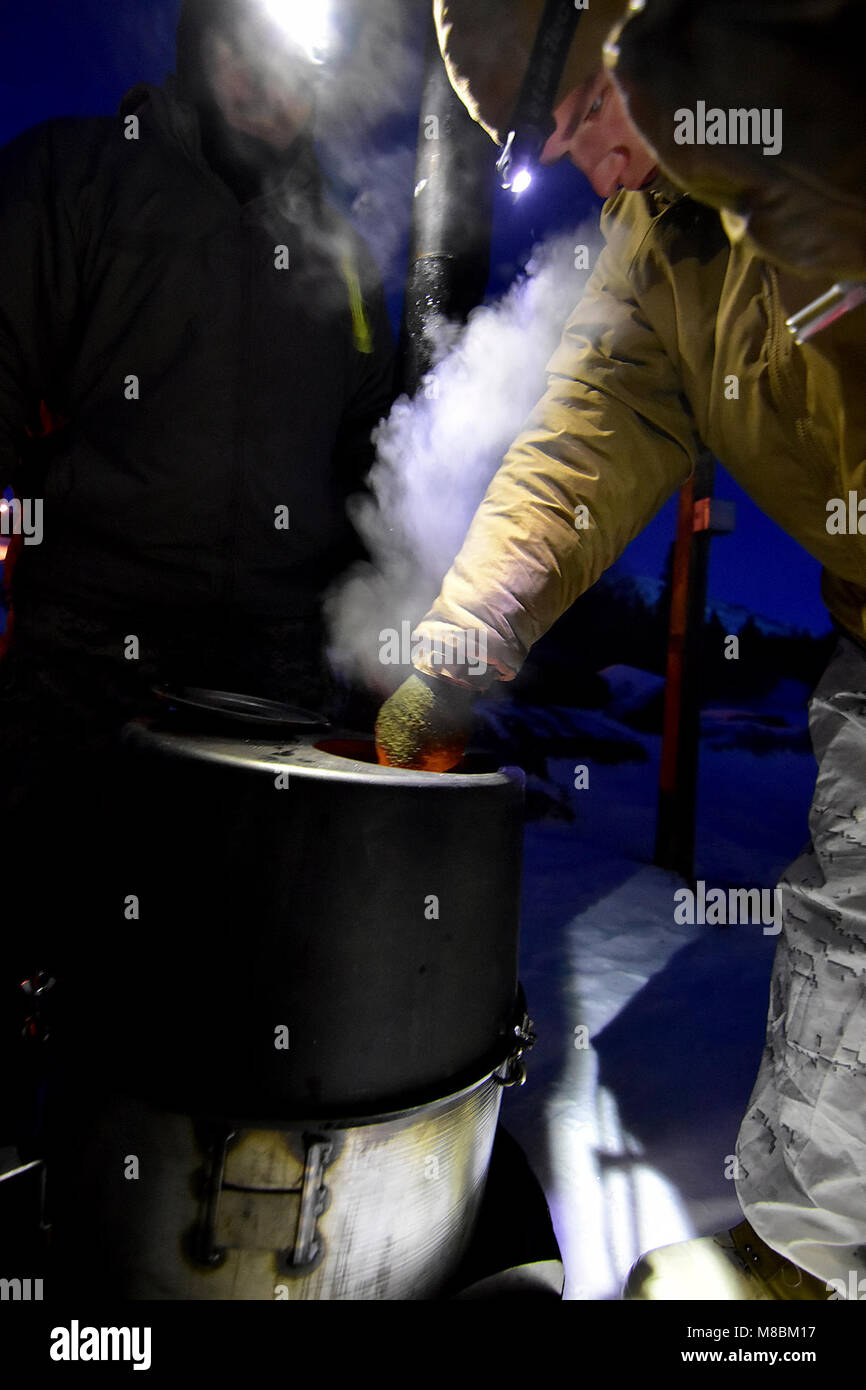 A group of Marines light an H45 Space Heater Feb. 20, 2018, at the ...