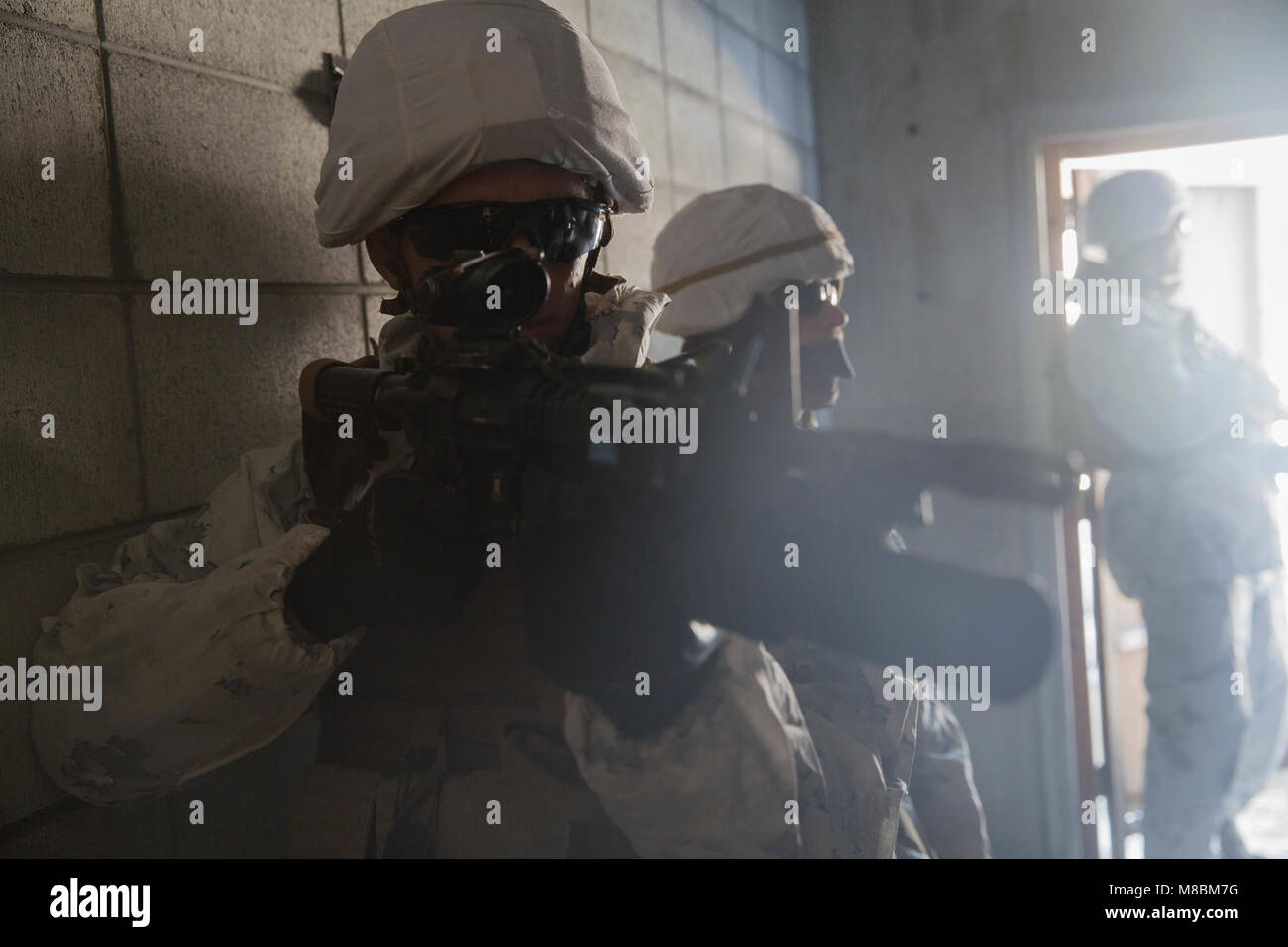 U.S. Marine Cpl. Jesse Lee breaches a building on Camp Sendai, Sendai ...