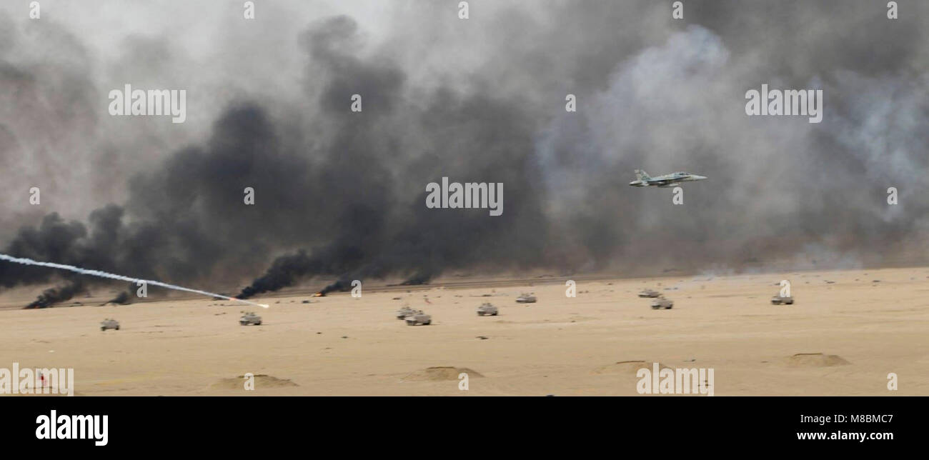 CAMP BUEHRING, KUWAIT- A Kuwaiti F/A-18 Hornet flies overhead as ...