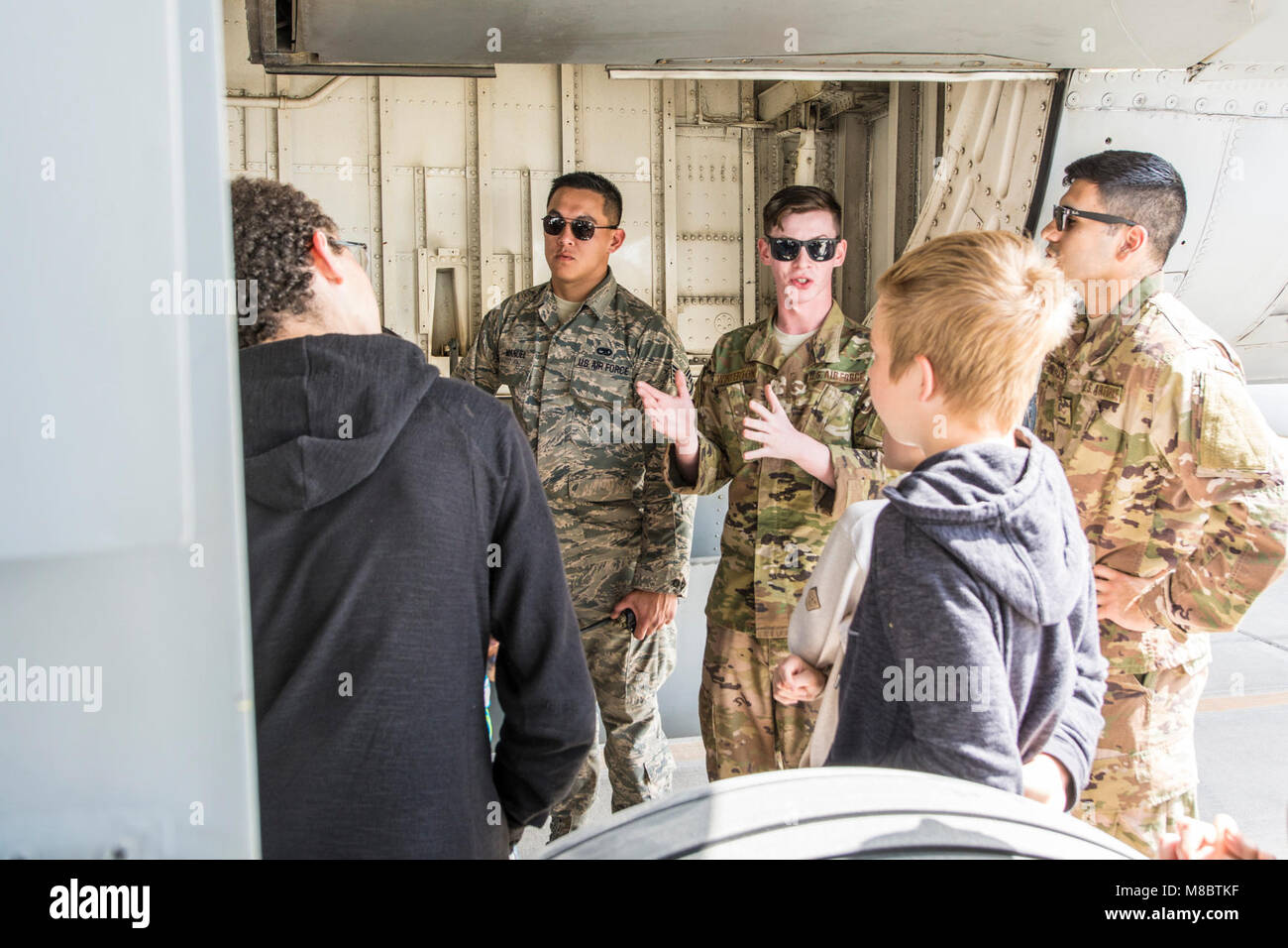 U.S. Air Force Airman 1st Class Tyler Winterton (center), crew chief ...
