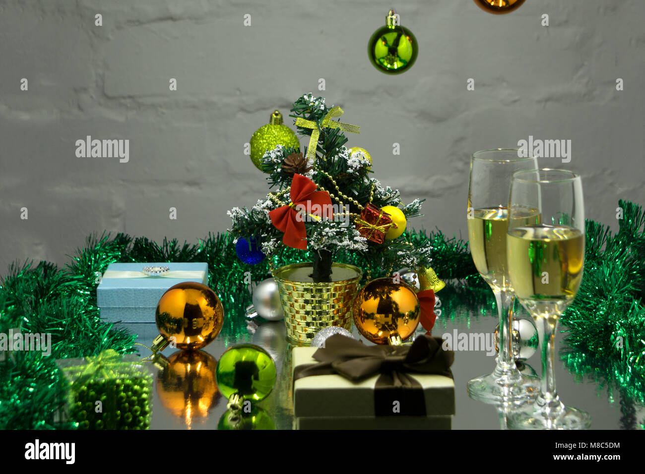 Christmas time and cheers concept. Male and female hands with drinks ...