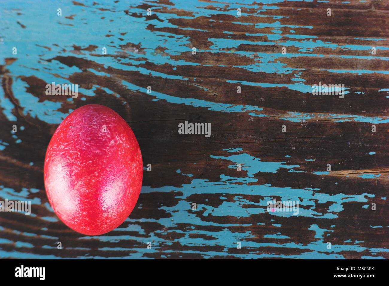 red easter eggs on vintage painted wooden background Stock Photo - Alamy