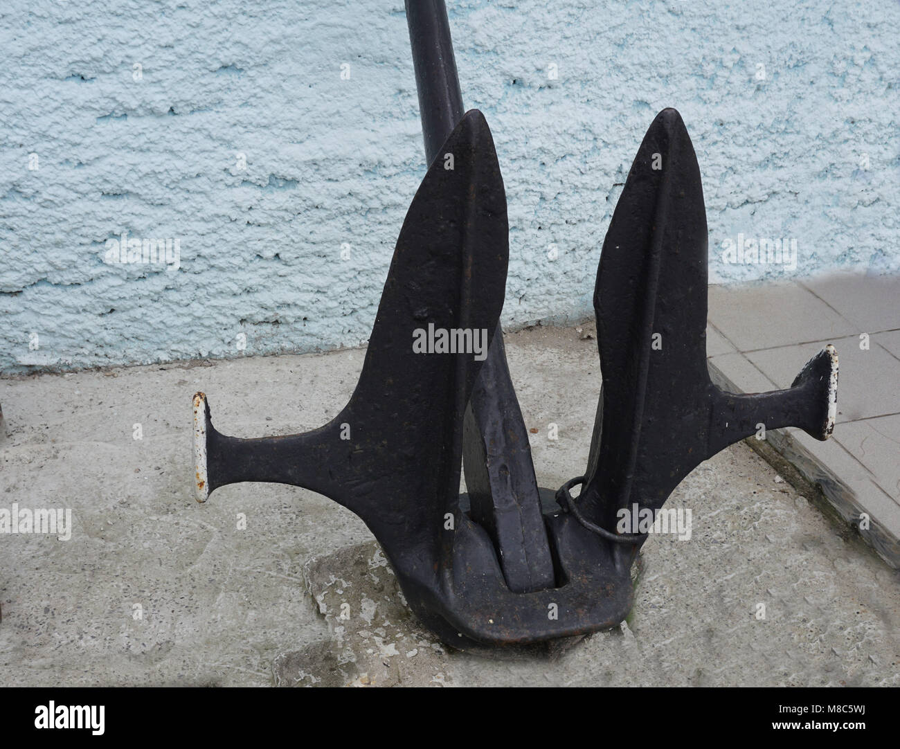Anchor on the embankment Stock Photo - Alamy