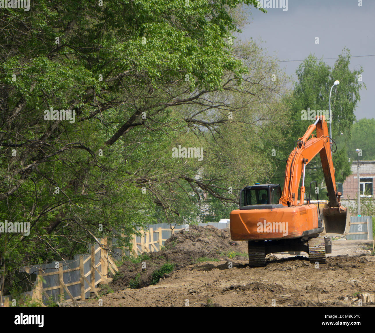 Excavators digging the ground Stock Photo - Alamy