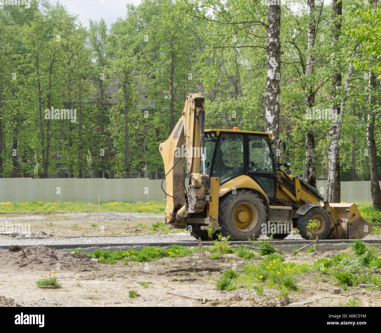 farm tractor with bucket down and hay and straw inside Stock Photo - Alamy