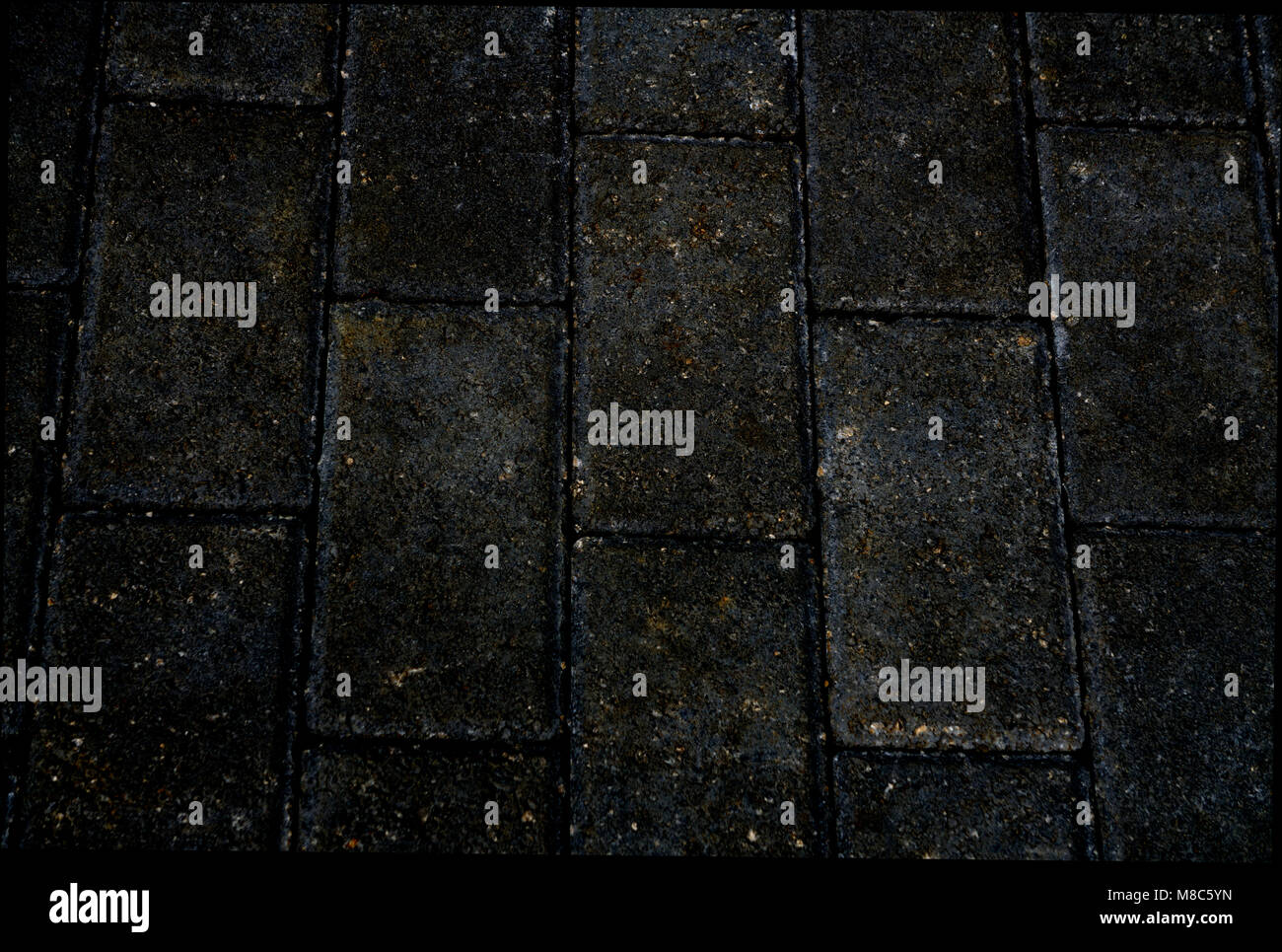 Scratched grey square road tiles texture Stock Photo - Alamy