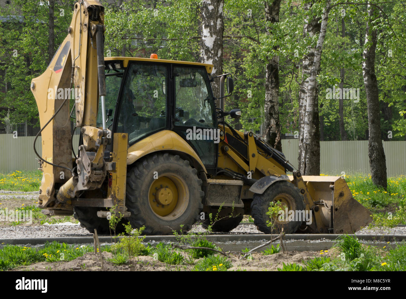 farm tractor with bucket down and hay and straw inside Stock Photo - Alamy