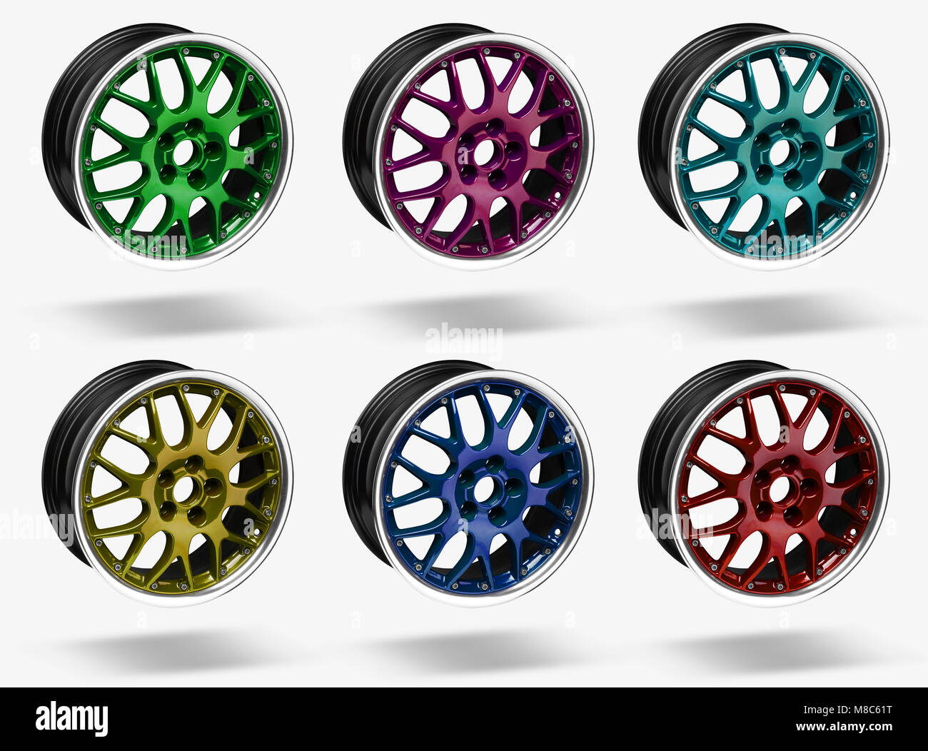 Colorful alloys rims floating in the air at white background, isolated ...