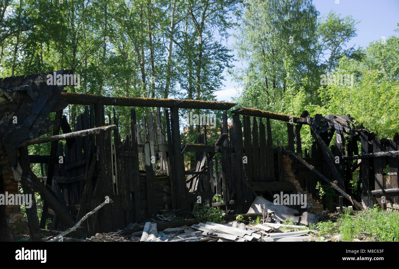 Morning view of a burnt down wooden house Stock Photo - Alamy