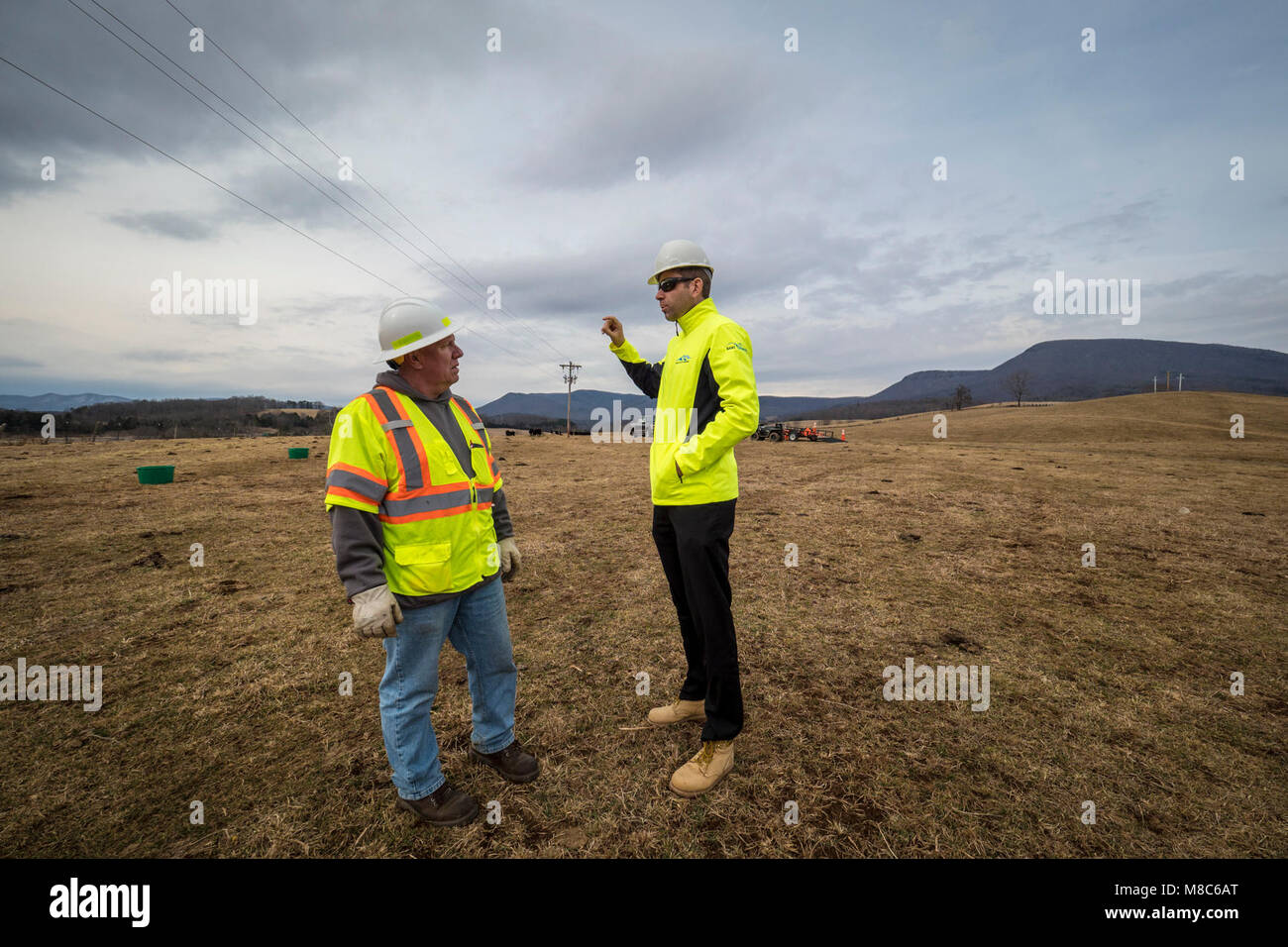 Virginia's BARC Electric Cooperative CEO Mike Keyser (R) talks with ...