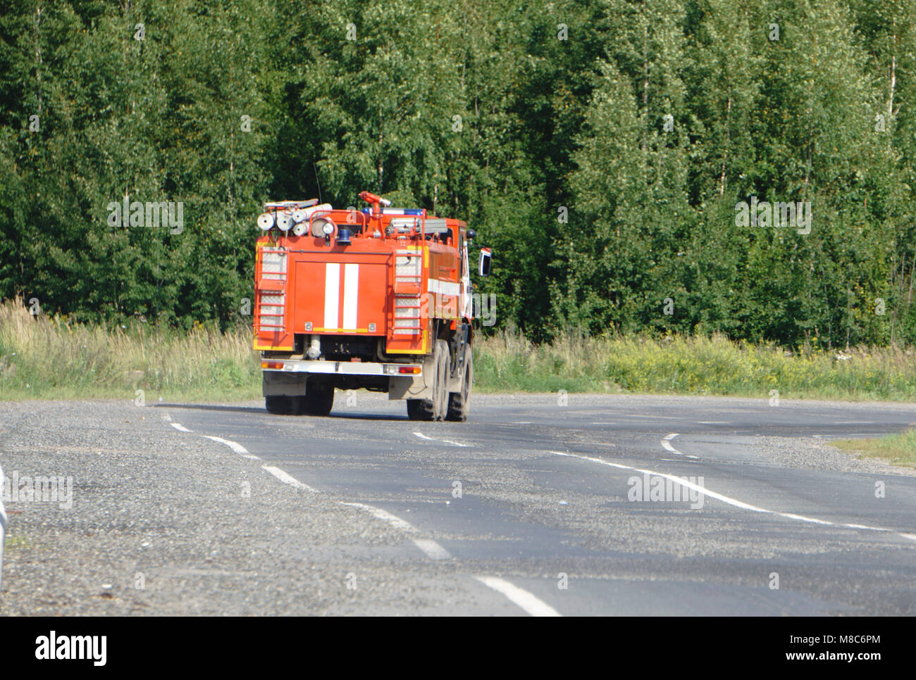 red Fire truck rides at the fire Stock Photo - Alamy