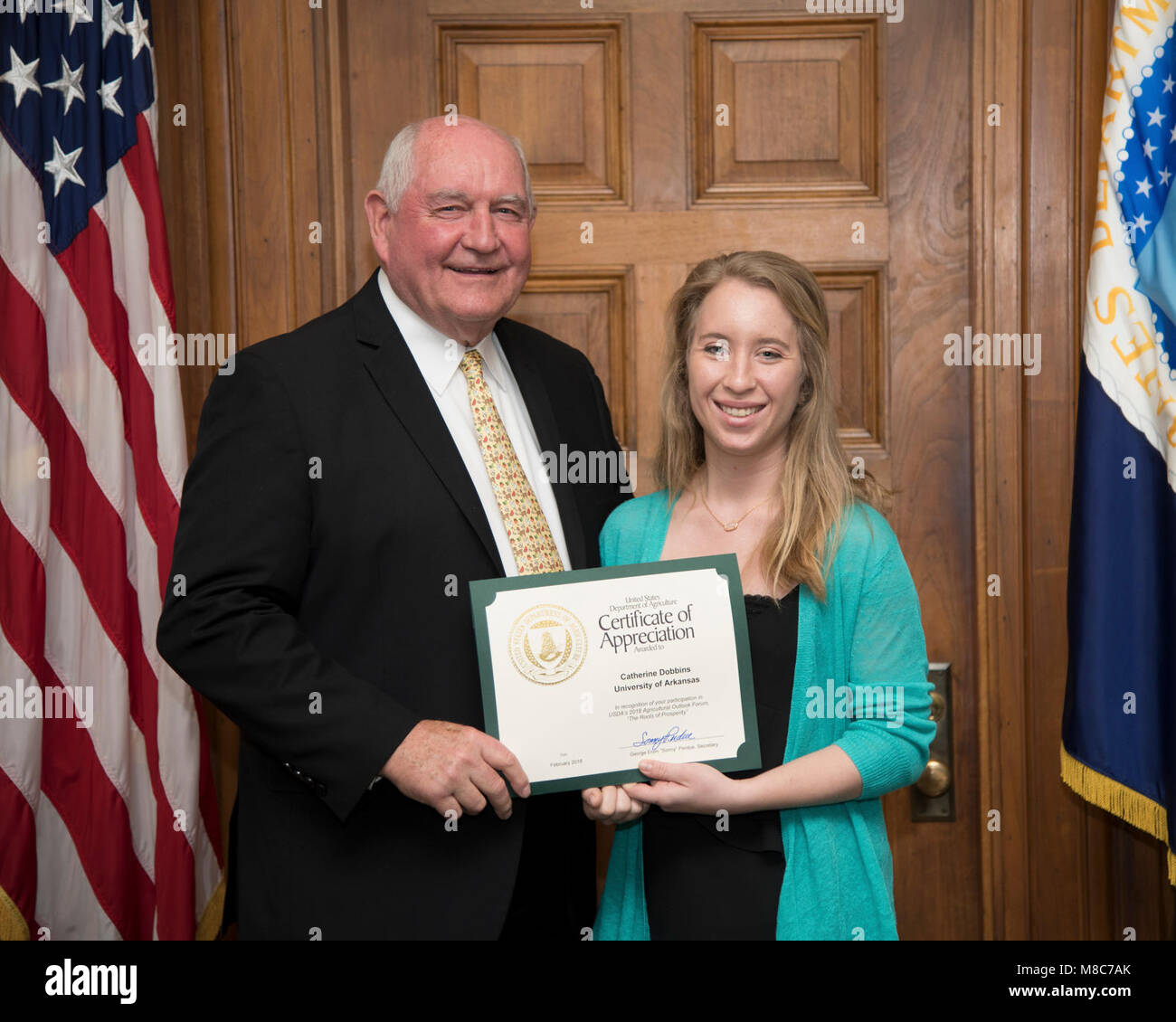 U.S. Department of Agriculture ) Secretary Sonny Perdue presents a ...