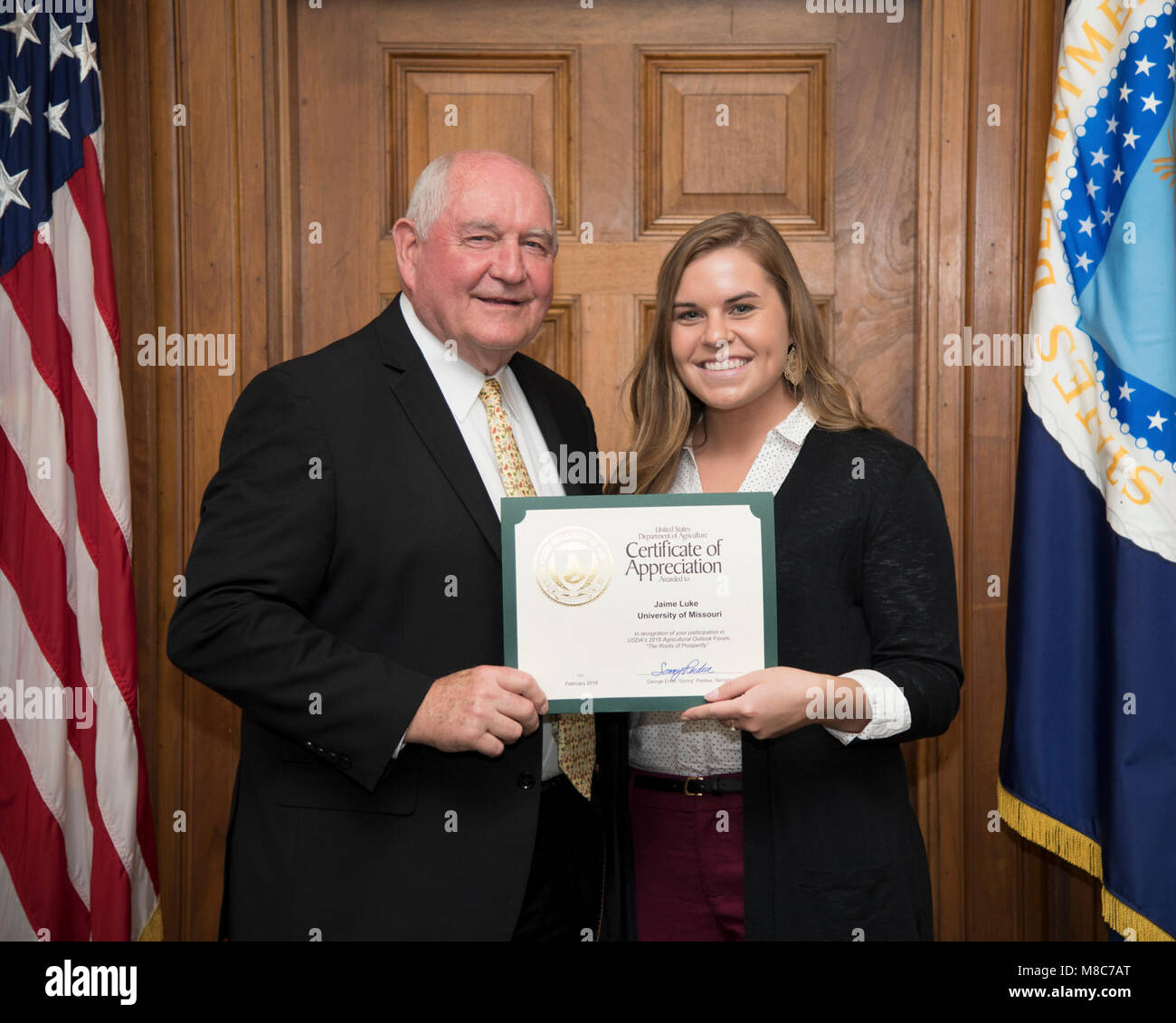 U.S. Department of Agriculture ) Secretary Sonny Perdue presents a ...