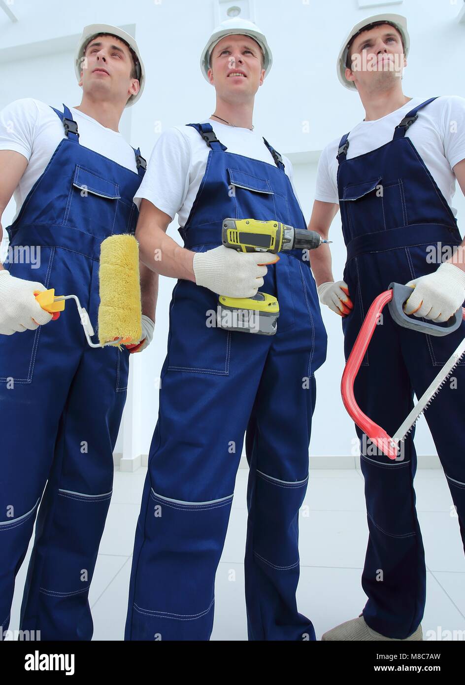 team of construction workers with working tools Stock Photo - Alamy