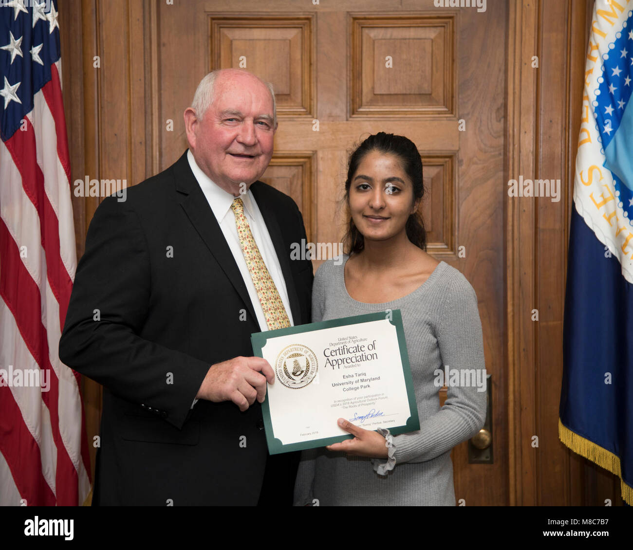 U.S. Department of Agriculture ) Secretary Sonny Perdue presents a ...