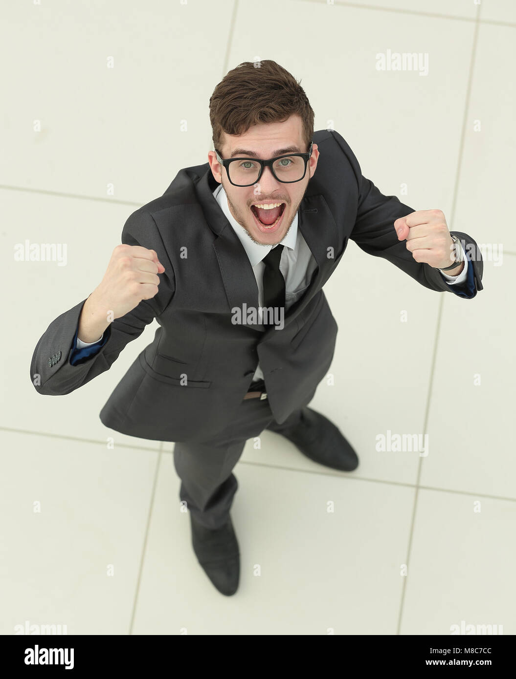 Businessman celebrating success Stock Photo - Alamy