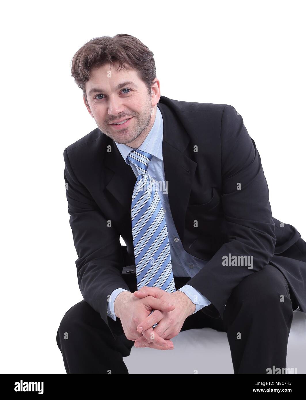 confident businessman sitting on chair Stock Photo - Alamy