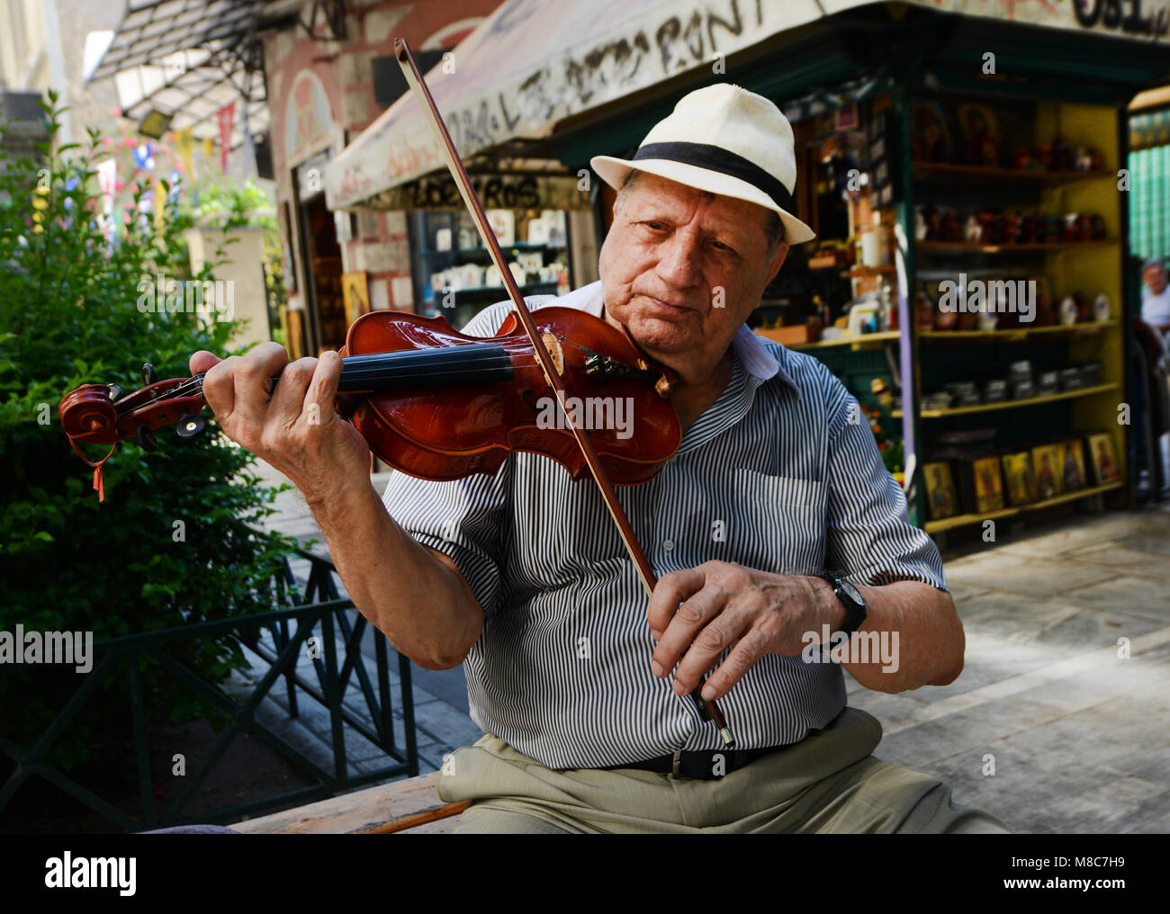 A Greek man playing his violin in central Athens Stock Photo - Alamy