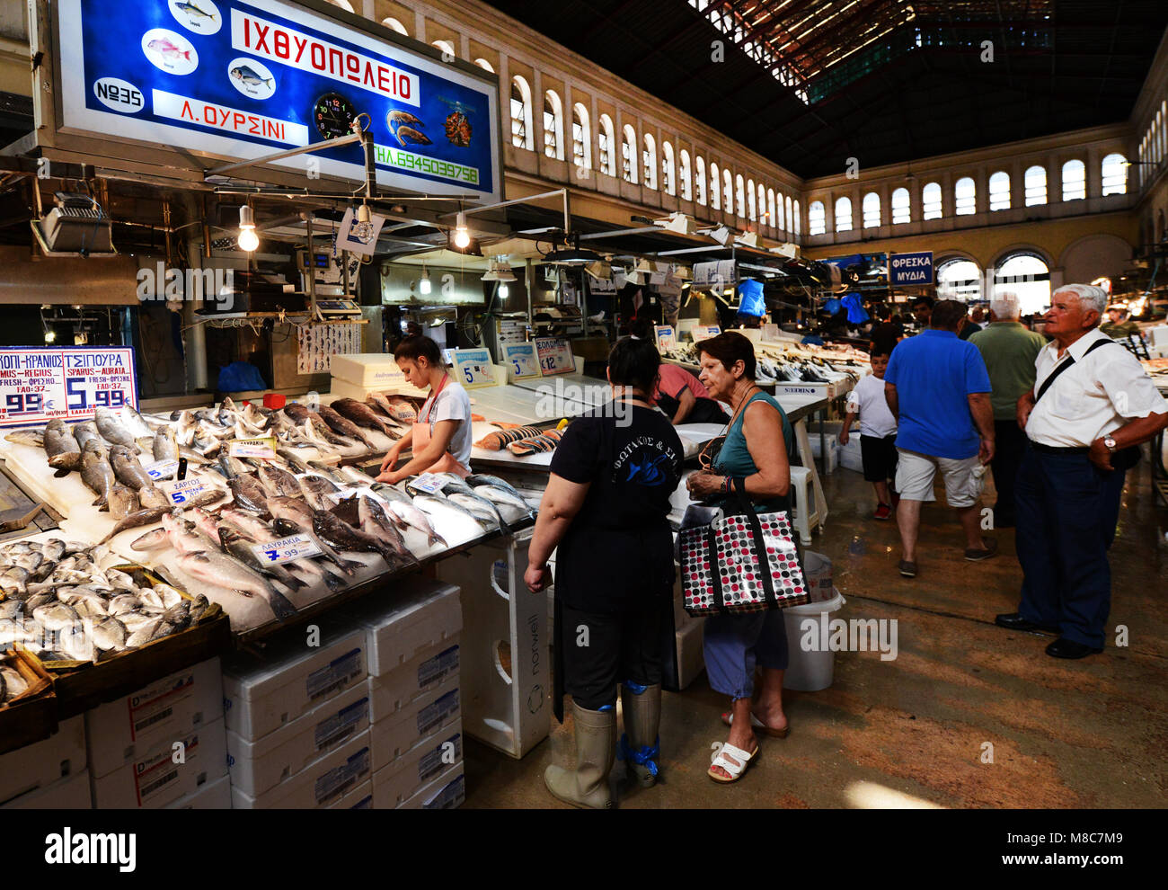 Customers purchasing fresh fish at the Varvakios Agora ( public market ...