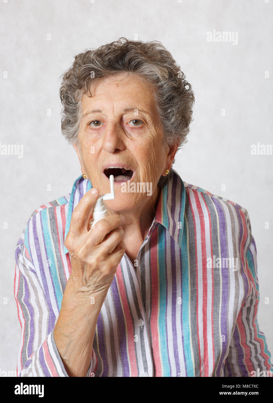 Old woman between 70 and 80 years old with a cold Stock Photo - Alamy