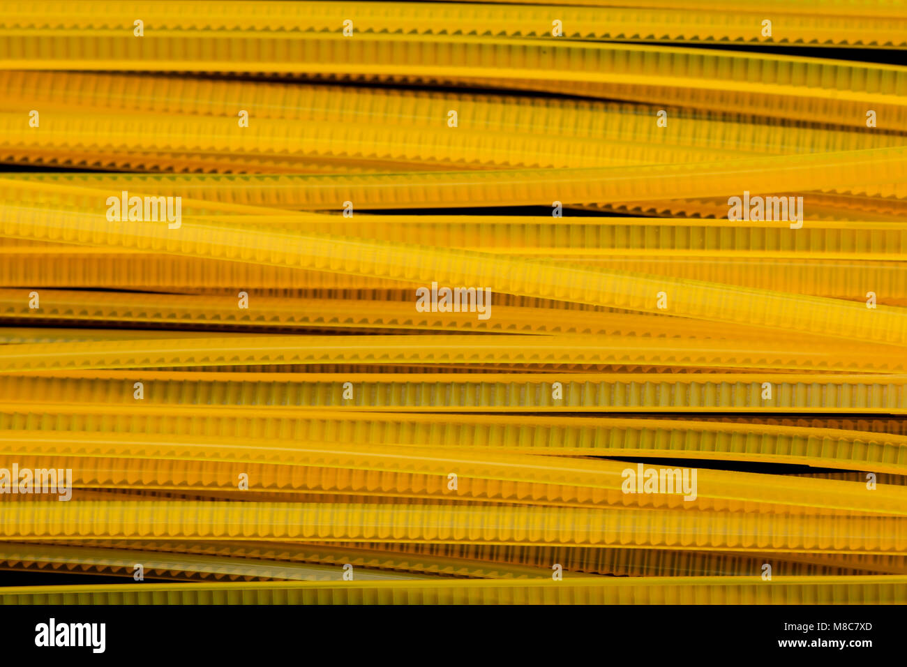 Yellow Nylon Cable Ties on black Background Stock Photo - Alamy