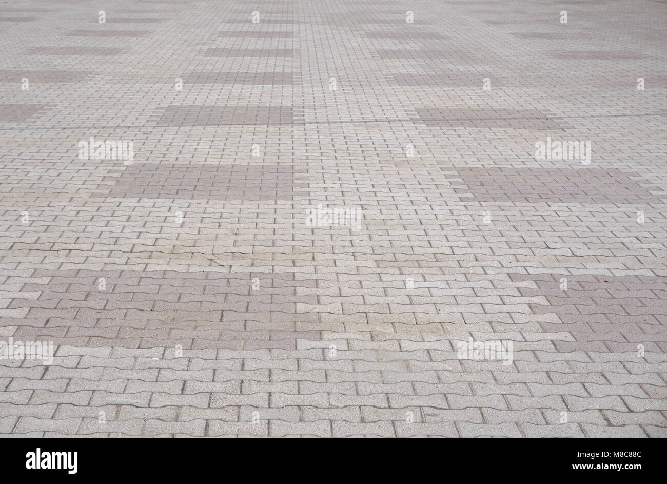 Texture of gray and yellow patterned paving tiles on the ground of ...