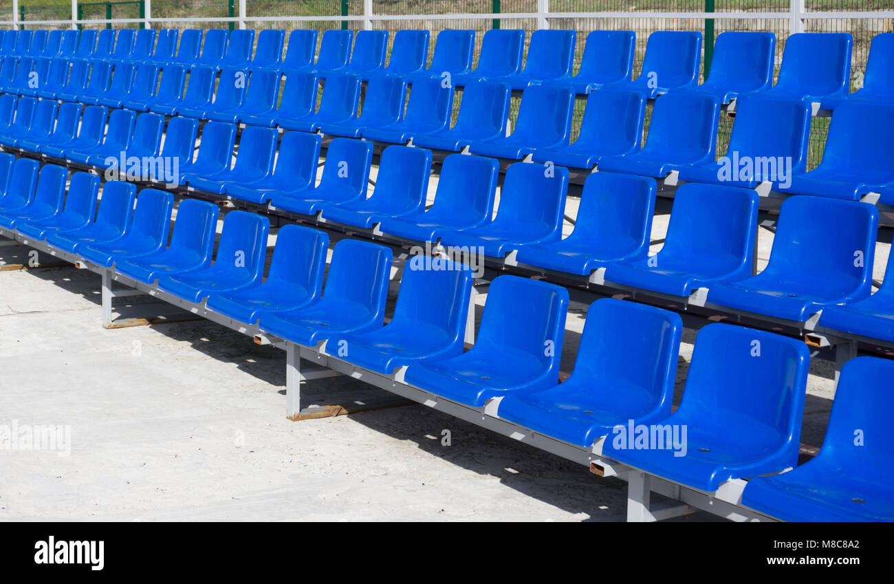 blue, red, white rows of seats on the stadium Stock Photo - Alamy