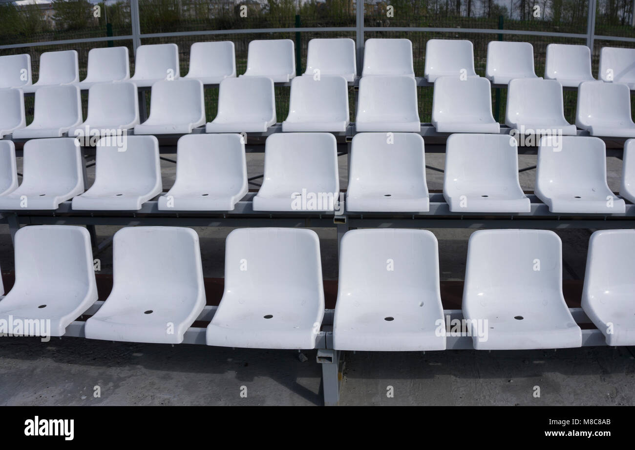 blue, red, white rows of seats on the stadium Stock Photo - Alamy