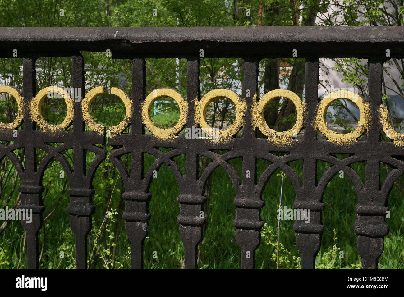 The Modern forged decorative fence with element casting . close-up ...