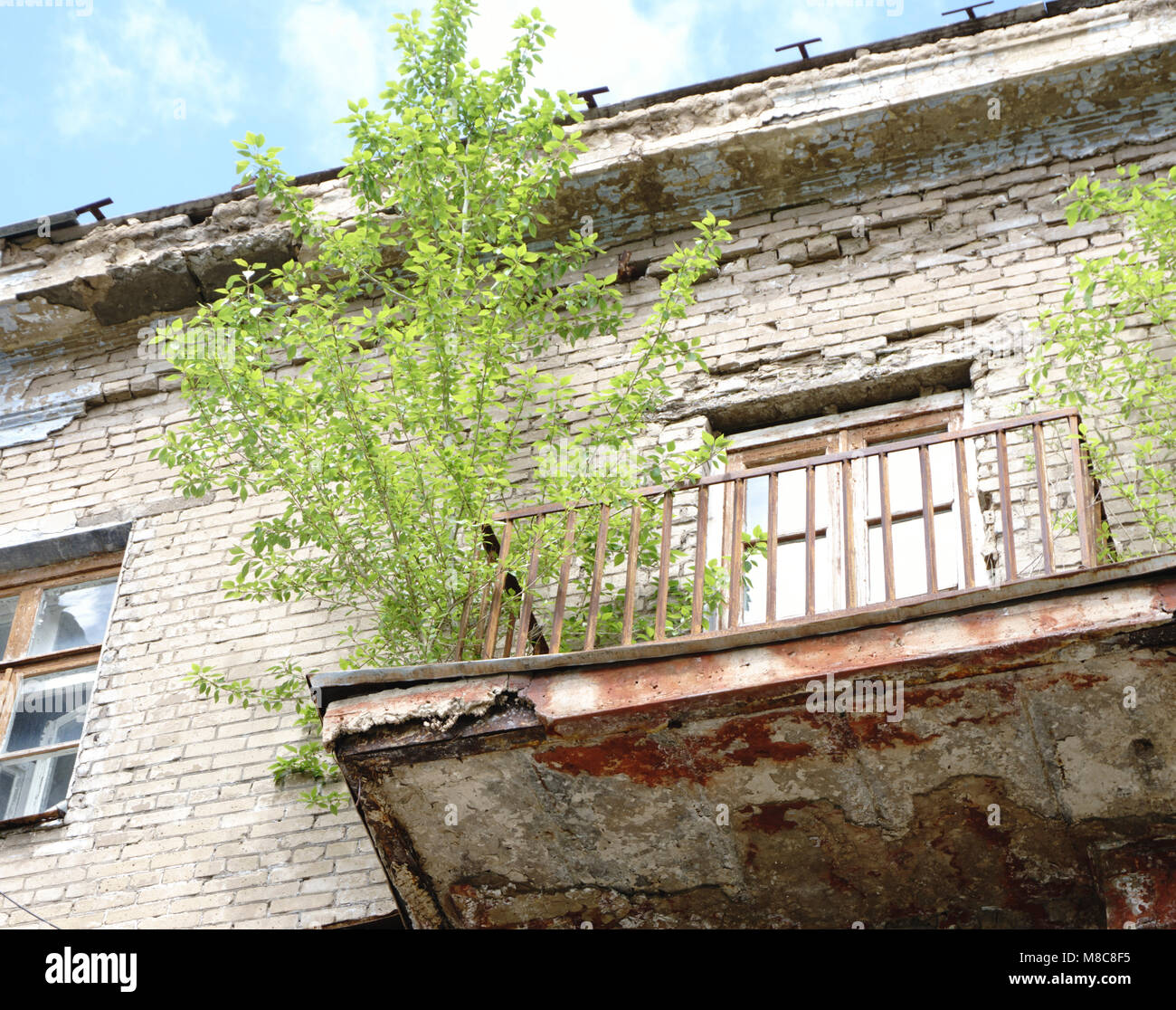 settled crumbling buildings with broken Windows Stock Photo - Alamy