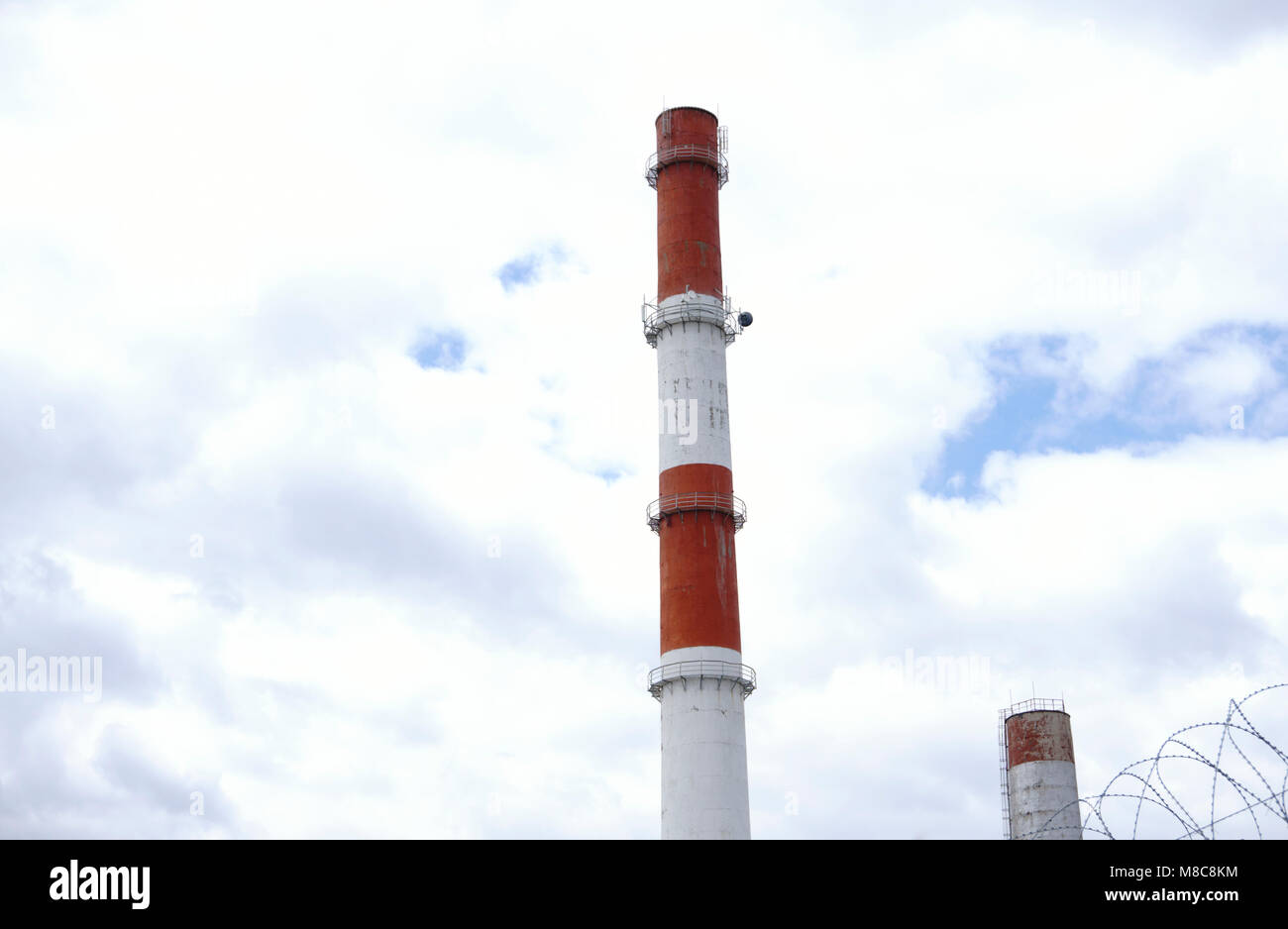 large factory chimneys on a sky background Stock Photo - Alamy