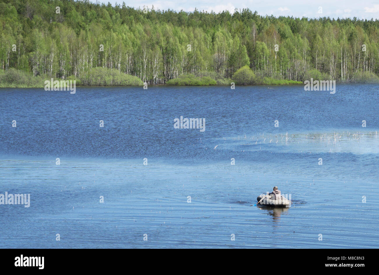 fishermen catch fish with a rubber boat Stock Photo - Alamy