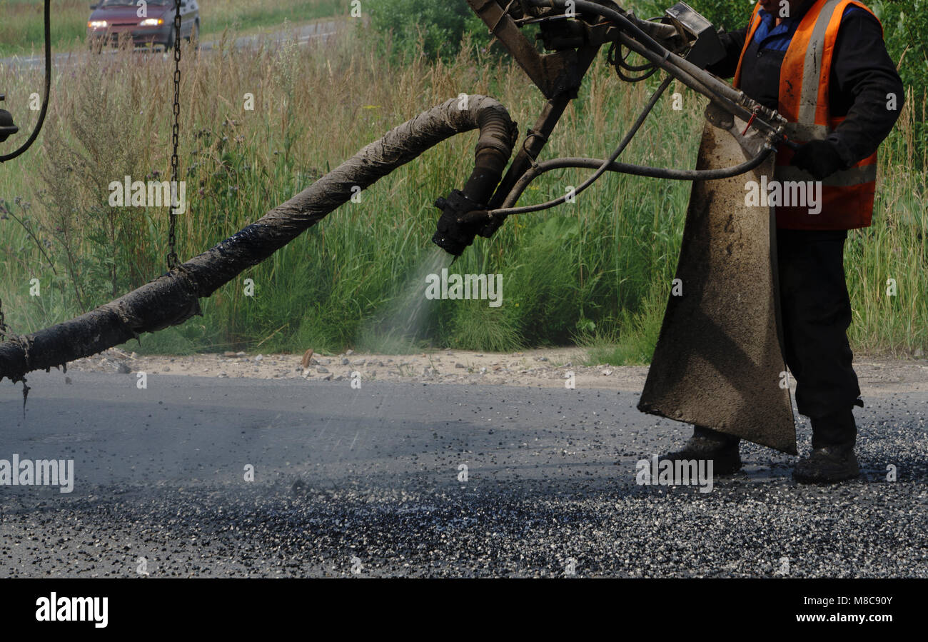 Asphalting machines hi-res stock photography and images - Alamy