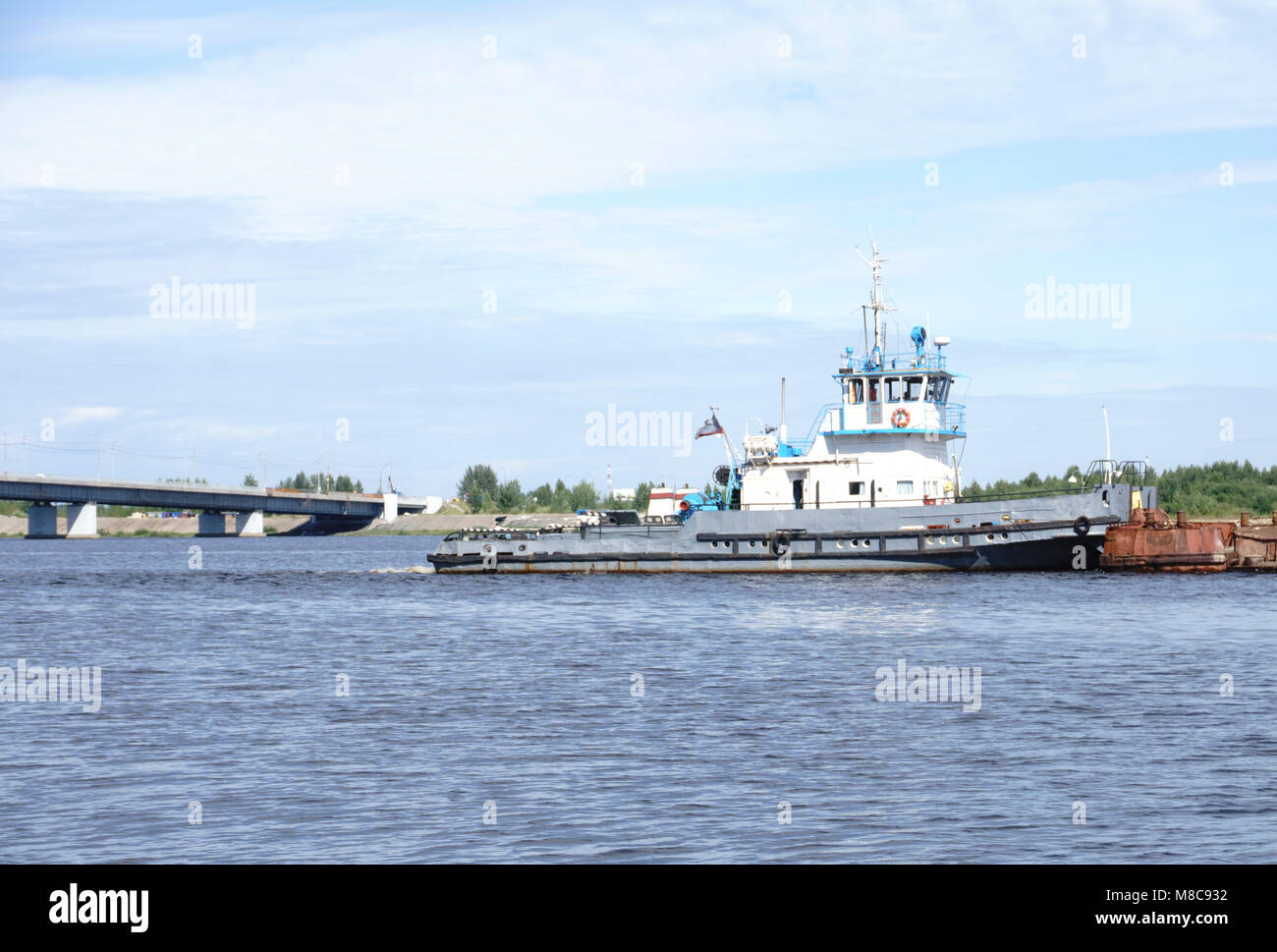 the Tug boat floats on the river Stock Photo - Alamy