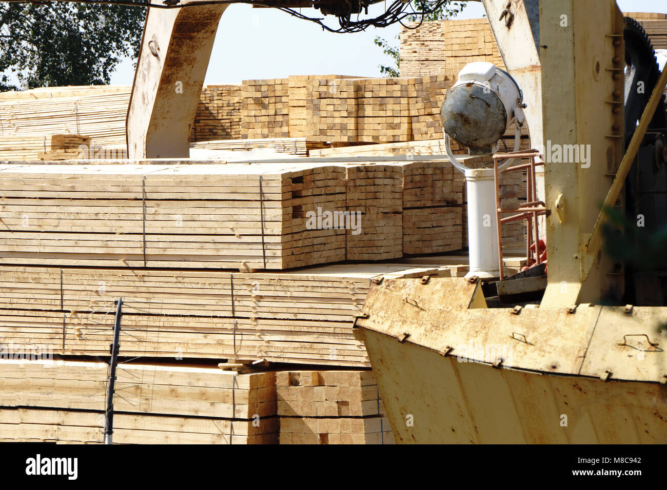 Timber is ready for shipping at a dock, Island Stock Photo - Alamy