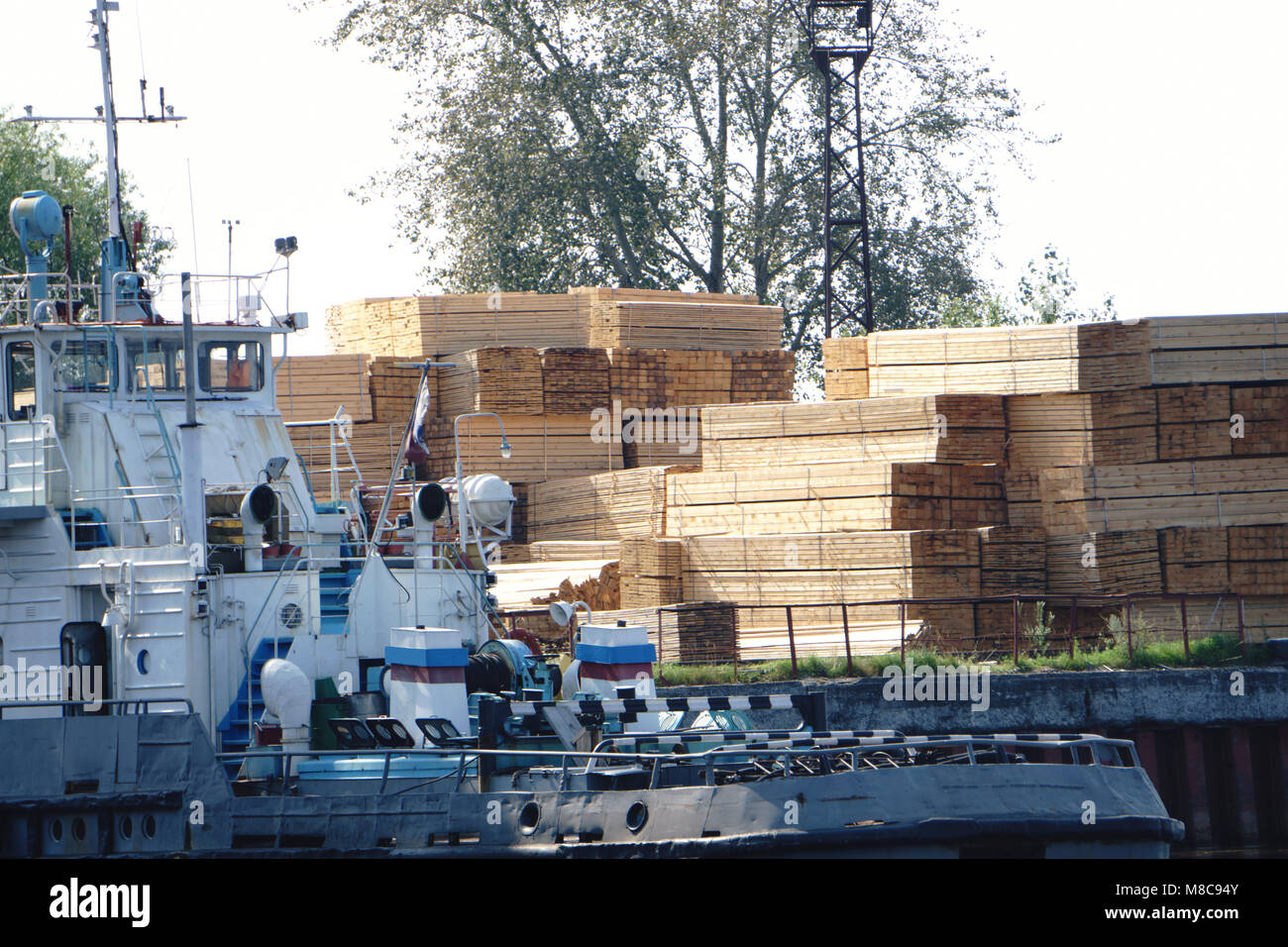 Timber is ready for shipping at a dock, Island Stock Photo - Alamy