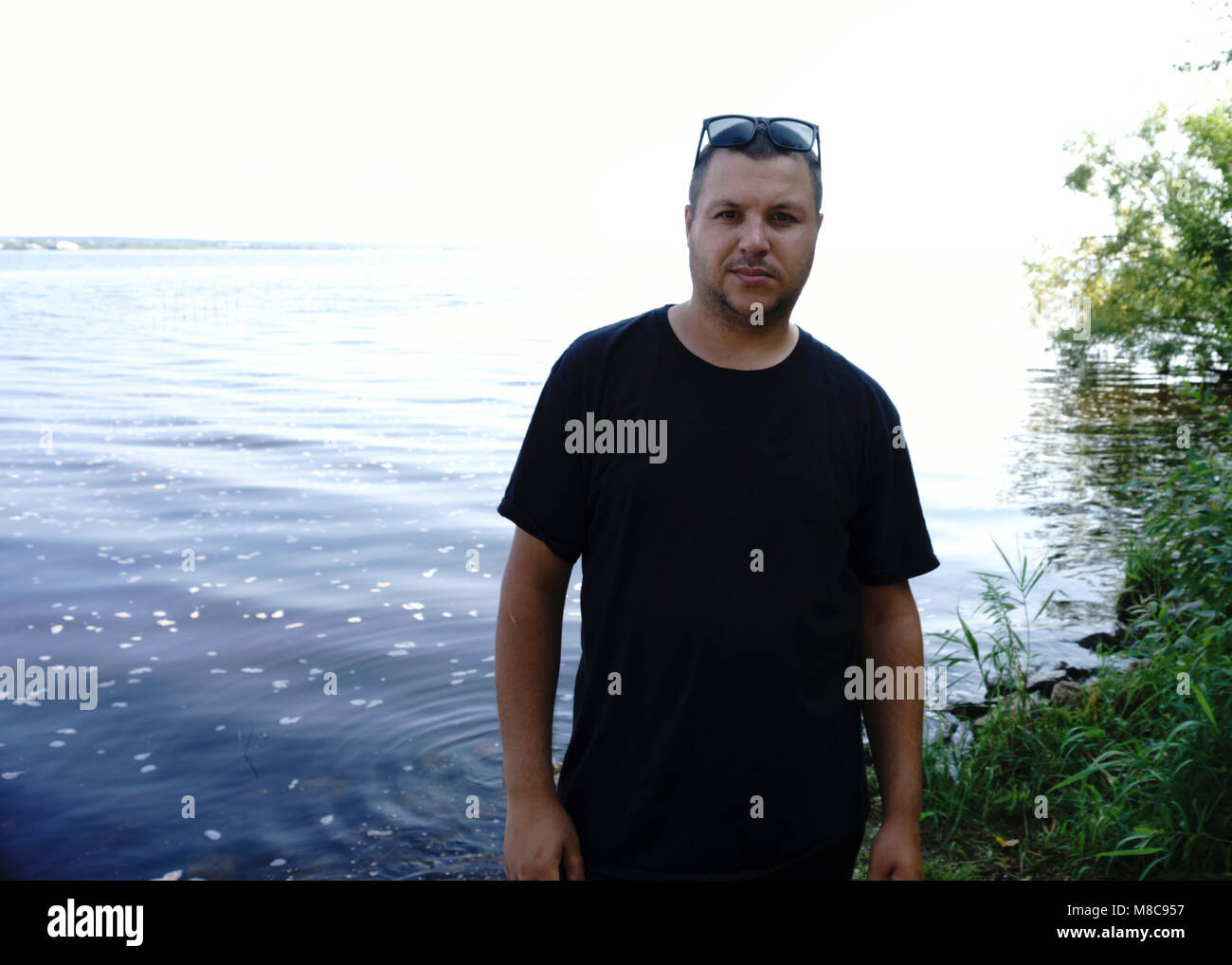 Handsome guy takes a selfie at the beach - people, lifestyle and ...