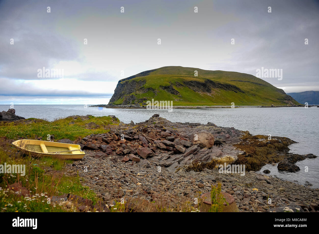 View across sea to Nordvagholmen from Mageroya Island, Nordkapp. Summer ...
