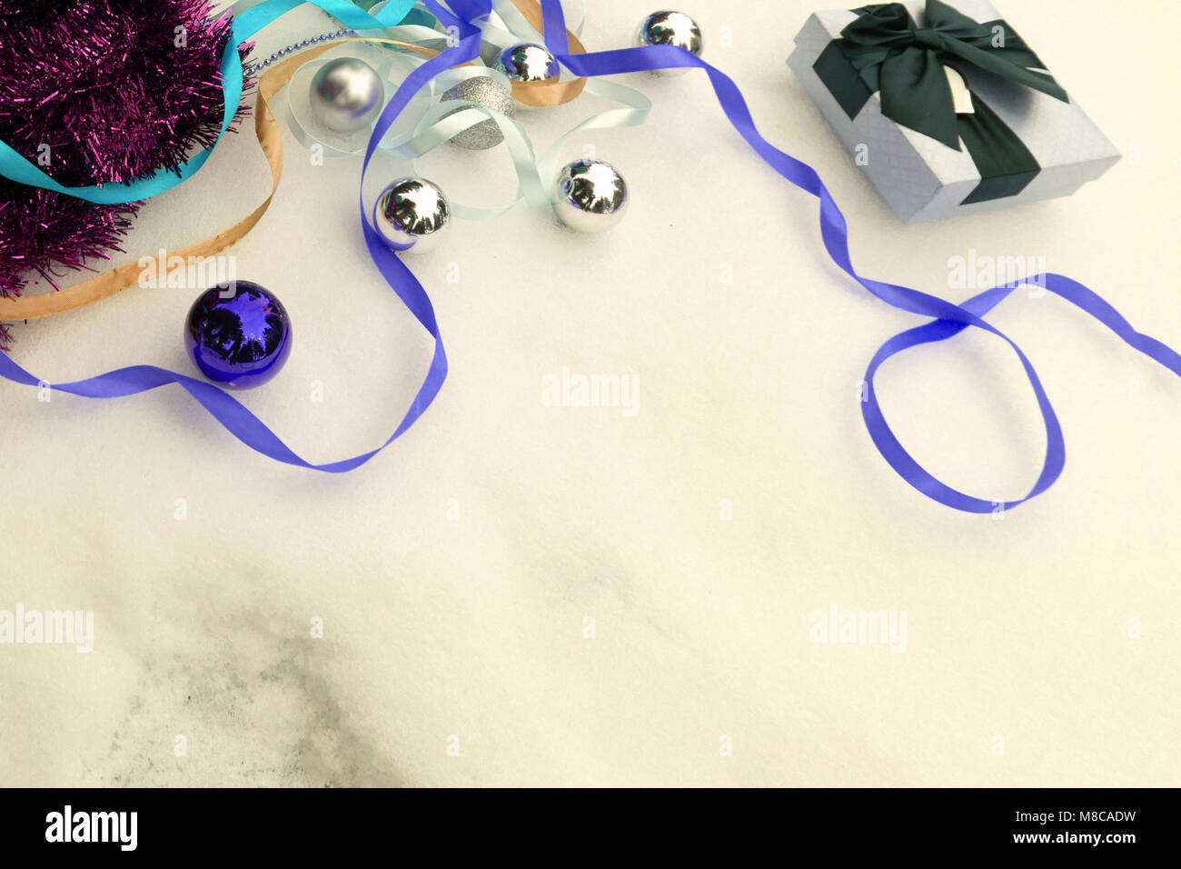 Red metallic bow at a christmas tree with coloured lights Stock Photo ...