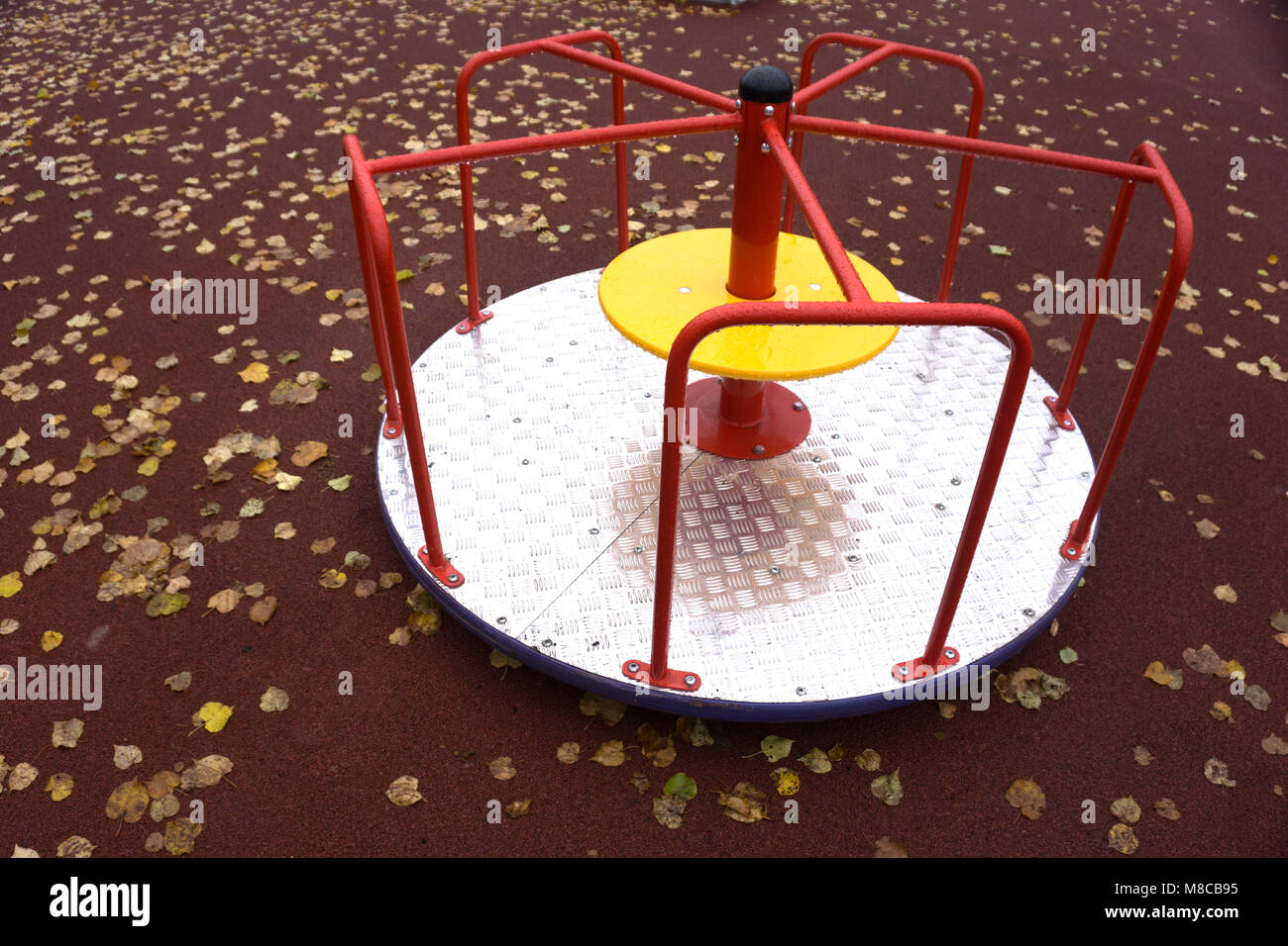 Little carousel. Colorful children Playground in the Park. Childhood ...