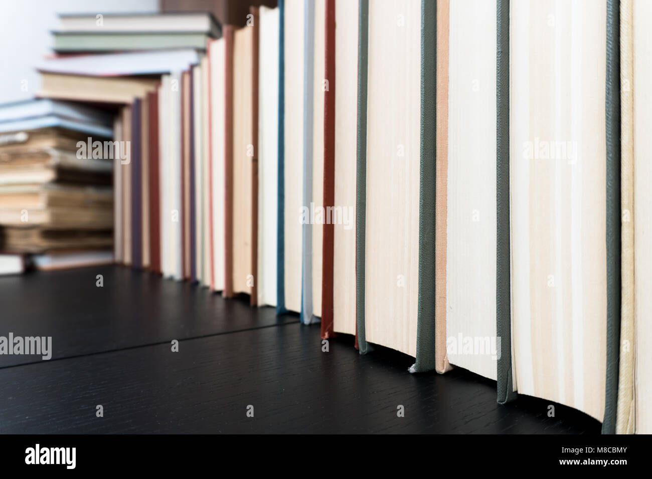 Many books in a bookstore or library Stock Photo - Alamy